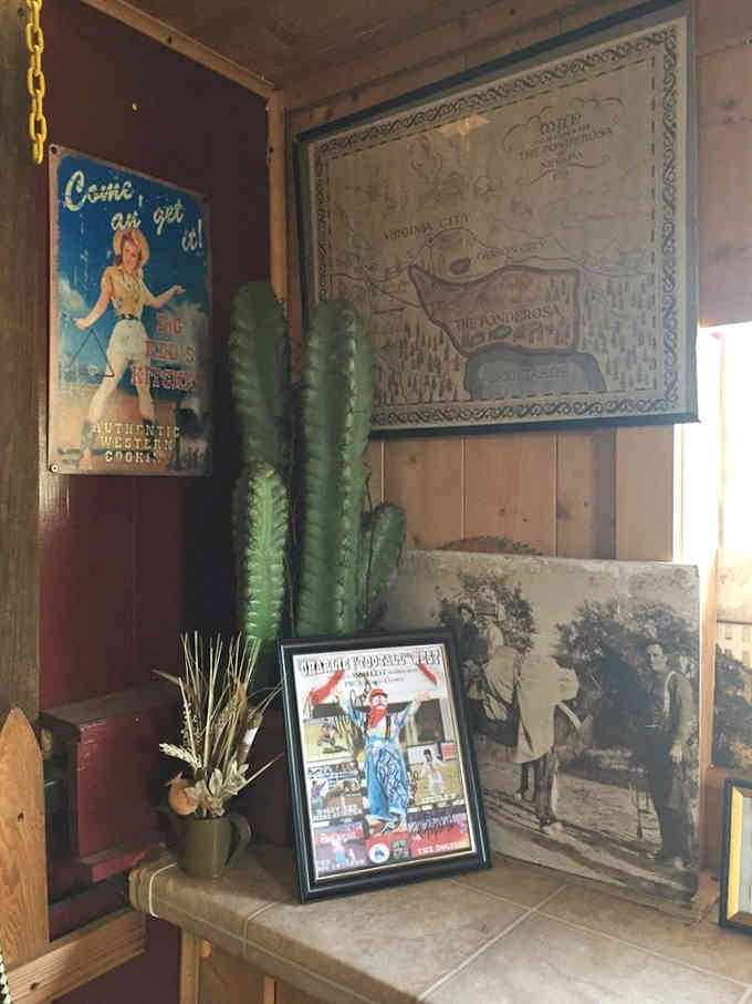 Vintage Western memorabilia and a tall cactus create an eclectic corner that feels like California's quirky attic, lovingly curated.