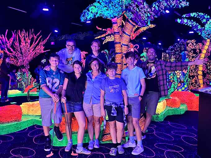 Nothing says "best birthday ever" quite like a group photo in a glowing underground wonderland.