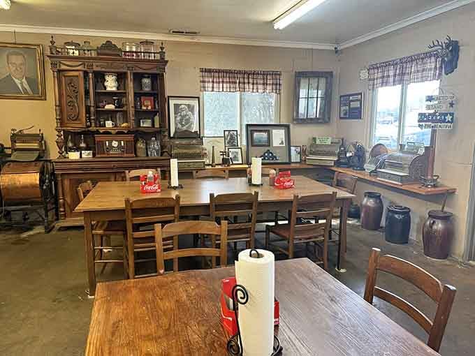 Vintage photographs and Coca-Cola signs adorn walls above tables set with paper towel rolls, ready for messy deliciousness ahead.