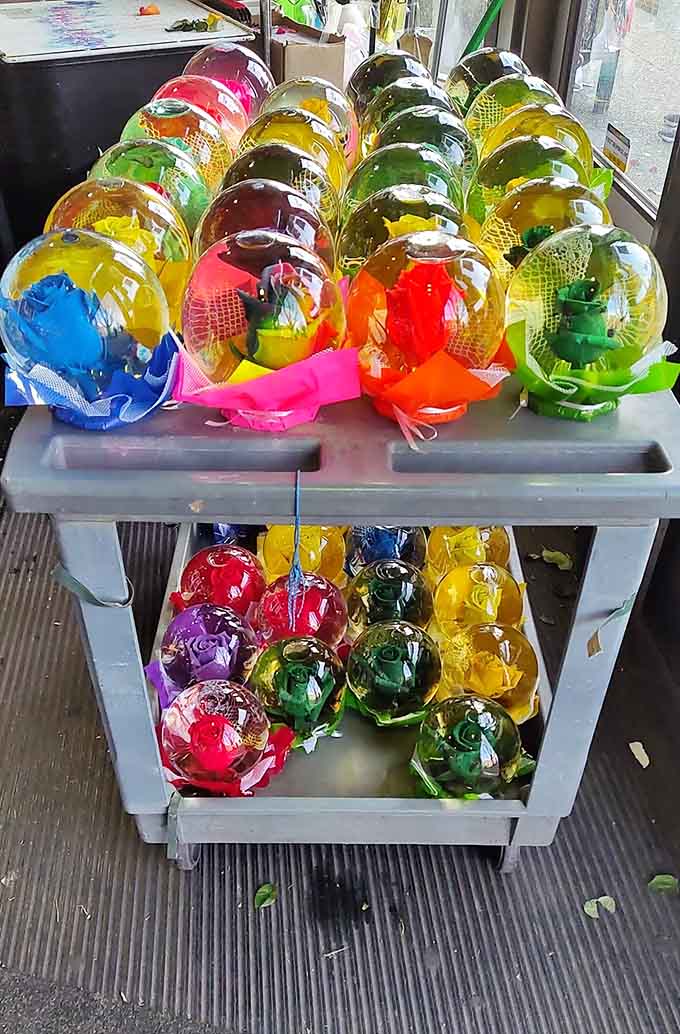 These colorful glass globes catch the light like captured rainbows, turning simple decorations into miniature works of art.