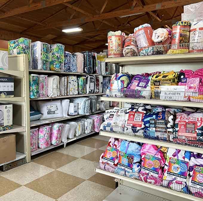 Cozy blankets and decorative pillows stacked high, because comfort shouldn't cost a fortune or your firstborn child.