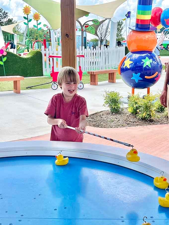 Simple carnival games that turn ordinary kids into champions, one rubber duck at a time with pure concentration.