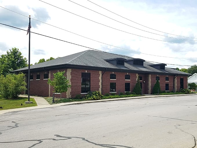 The public library serves as the town's intellectual heart, housed in solid brick that promises permanence and community.
