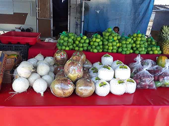 Fresh produce piled high in vibrant green pyramids, making your grocery store's selection look downright apologetic by comparison.