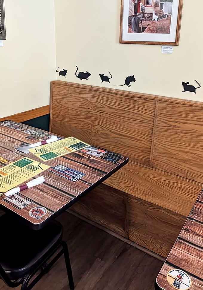 Wood-grain tables and a cozy booth create the kind of atmosphere where strangers become friends over shared meals.