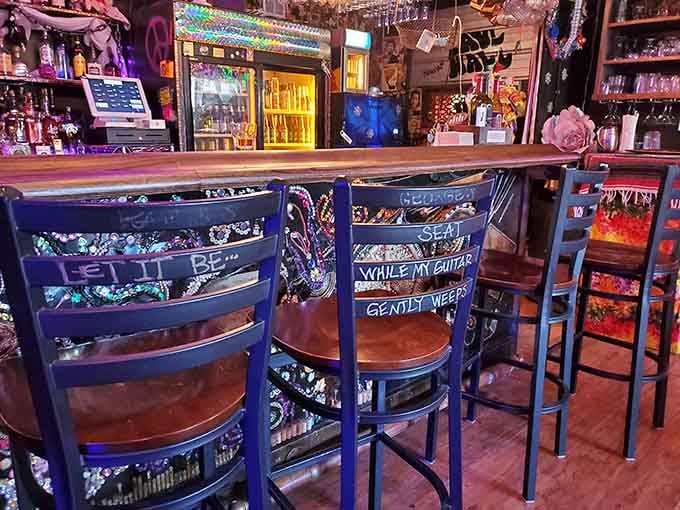 Bar stools decorated with Beatles lyrics invite you to sit, stay, and probably never want to leave this place.