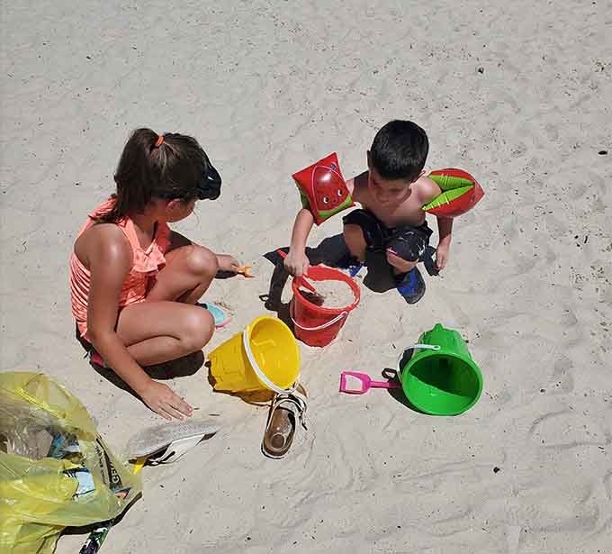 Little hands discovering real sand and beach toys prove some joys are truly timeless and universal.
