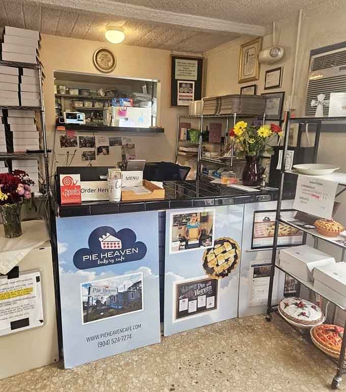 The counter where pie dreams come true, stacked with fresh-baked goodness waiting for lucky customers.