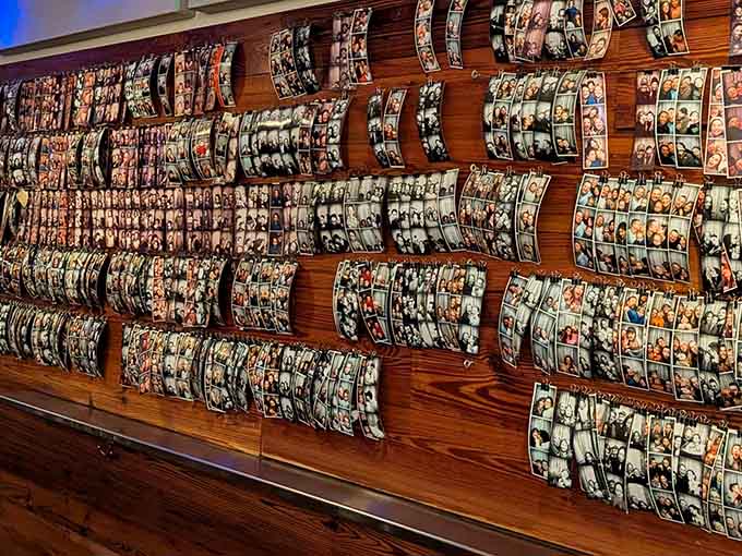 This photo wall chronicles countless happy moments, a testament to pizza's power to create memories.