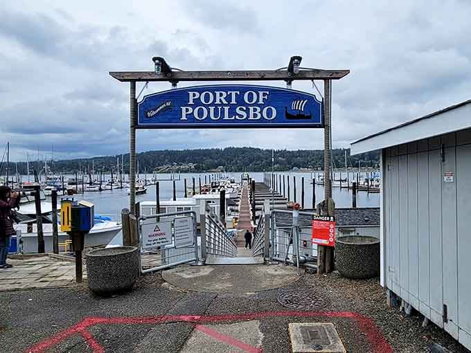 Those carved fish flanking the marina entrance welcome sailors and landlubbers alike to Liberty Bay's peaceful waters.