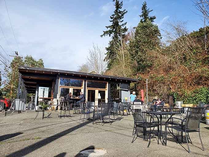 Outdoor tables catch afternoon shadows at this cozy spot where craft beer enthusiasts gather for locally brewed refreshment.