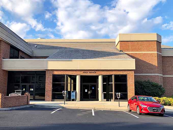 Modern brick facade proves the post office evolved beyond those cramped spaces where you'd wait forever for stamps.