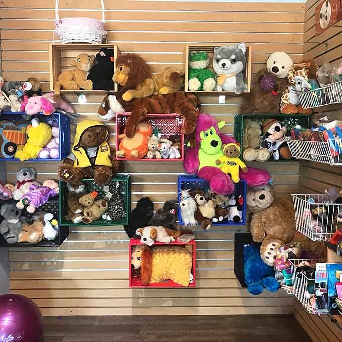 Stuffed animals crowd the display like a plush toy convention, ready to comfort kids or nostalgic adults alike.