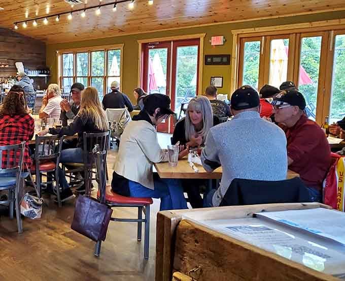 Real people enjoying real barbecue in a space that feels like your coolest friend's lake house went commercial.