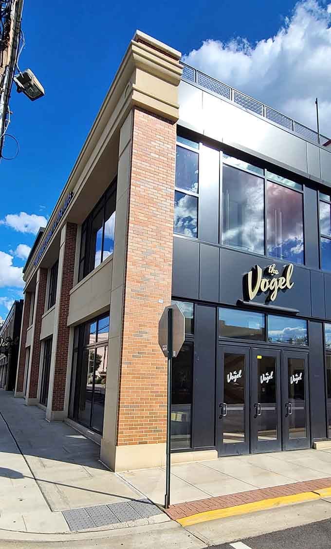 The Vogel's contemporary facade catches clouds in its glass, blending tomorrow's design with today's downtown energy.