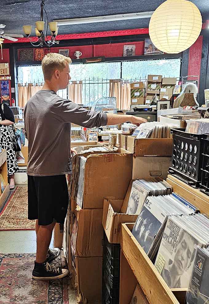 Lost in the hunt, this customer knows the truth: finding the perfect record requires patience, dedication, and sore fingers.