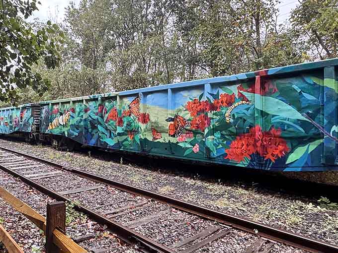 Graffiti-adorned relics stand sentinel along the route, reminding us that even trains eventually retire and find new purpose.