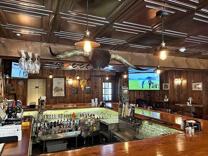 The bar area features warm wood tones and enough bottles to keep conversations flowing smoothly.