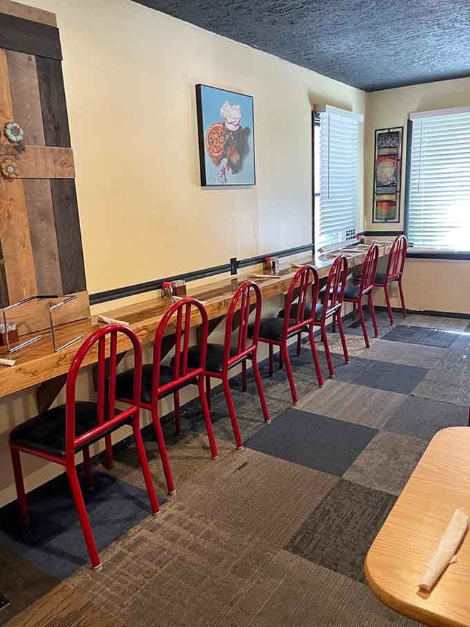 Long communal tables where strangers become friends over shared pizza and good conversation always.