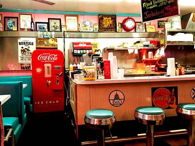 The counter seating offers front-row views to the show, complete with vintage Coca-Cola charm everywhere.