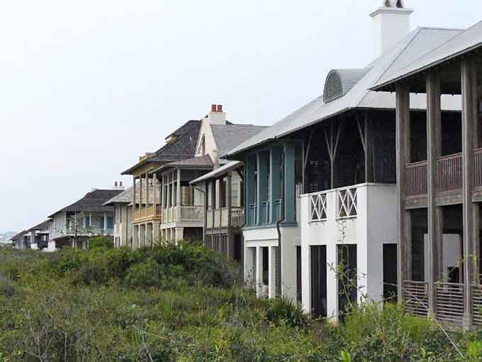Beachfront homes nestle into natural dunes like they've always been there, respecting the landscape instead of dominating it completely.