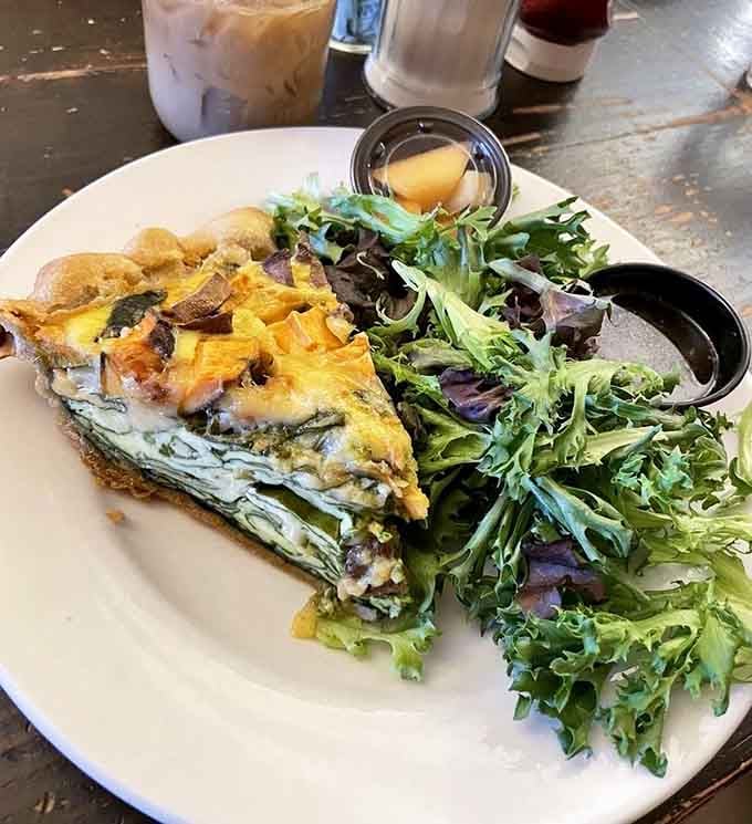 Veggie quiche proving that vegetables can be just as exciting as their breakfast meat counterparts any day.