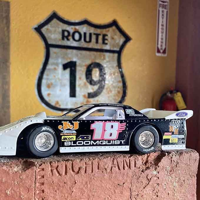 That vintage race car model sitting pretty reminds you this place has personality to spare and then some.