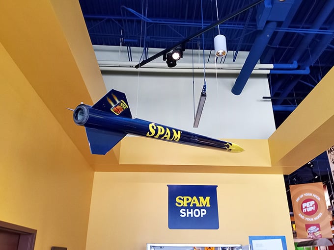 A SPAM-branded rocket hangs overhead, symbolizing this humble product's astronomical rise to cultural icon status.