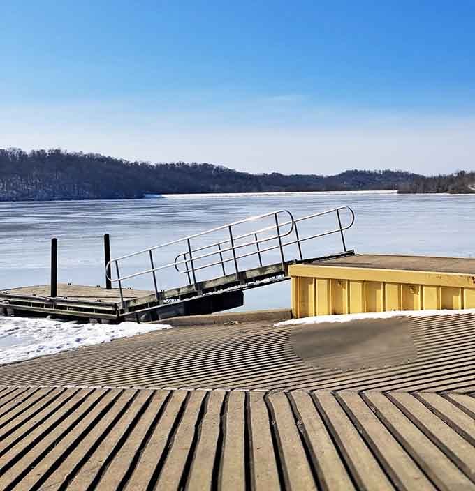 The frozen lake and dock remind you that winter fishing requires dedication, insulated boots, and possibly therapy.