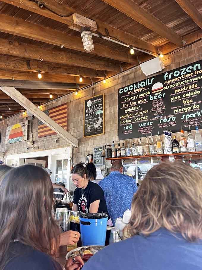 The bar area where drinks are mixed, orders are placed, and summer memories officially begin their formation process.