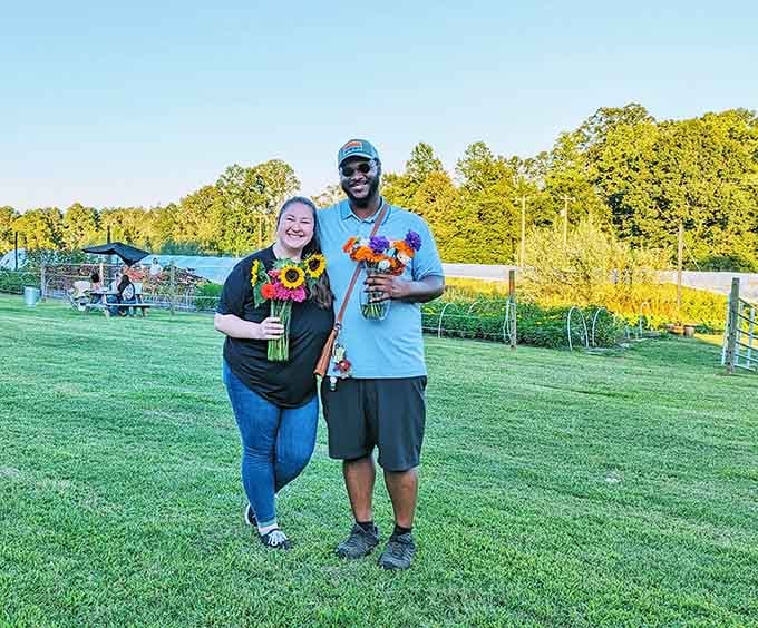 Two happy visitors prove that flower picking is the rare activity that looks good on absolutely everyone who tries it.