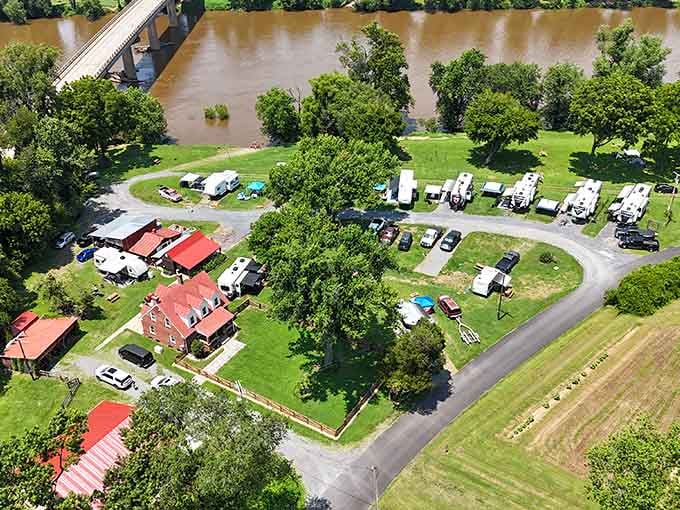 Horseshoe Flats offers riverside camping spots where RVs nestle among trees beside the muddy James River waters.