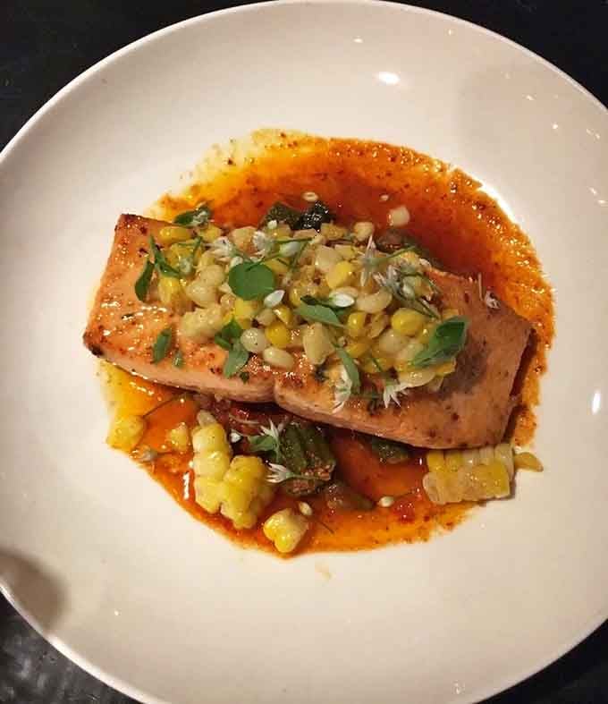 Salmon that looks like it jumped straight from the water onto your plate via culinary magic school.
