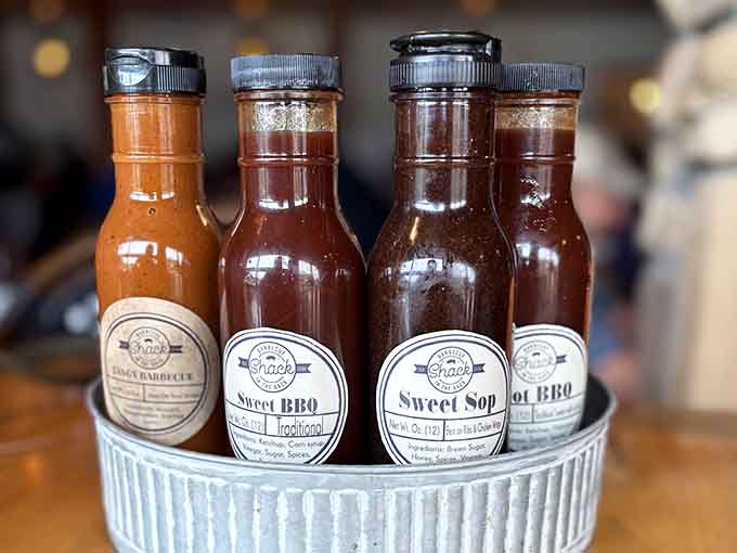 House-made sauces lined up like flavor soldiers, each one ready to enhance your barbecue experience perfectly.