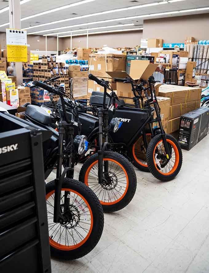 Electric bikes with orange wheels looking like they escaped from a futuristic movie set, ready for eco-friendly adventures around town.