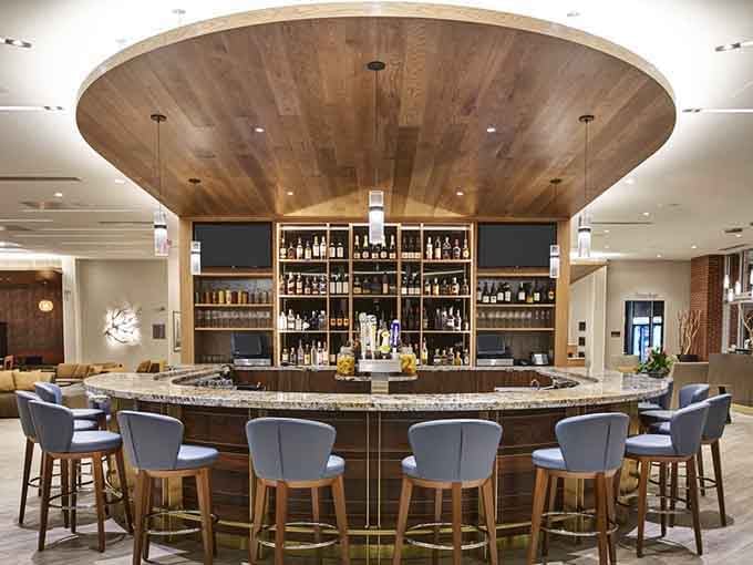 A circular bar topped with a stunning wooden ceiling detail that makes grabbing a drink feel like a special occasion.