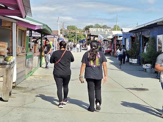 Shoppers stroll past colorful stalls like kids in the world's most eclectic candy store for grown-ups.