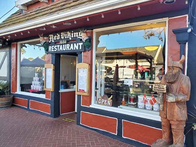 The Red Viking Restaurant stands ready with authentic Danish fare, complete with a wooden Viking guarding the entrance like Scandinavia's friendliest bouncer.