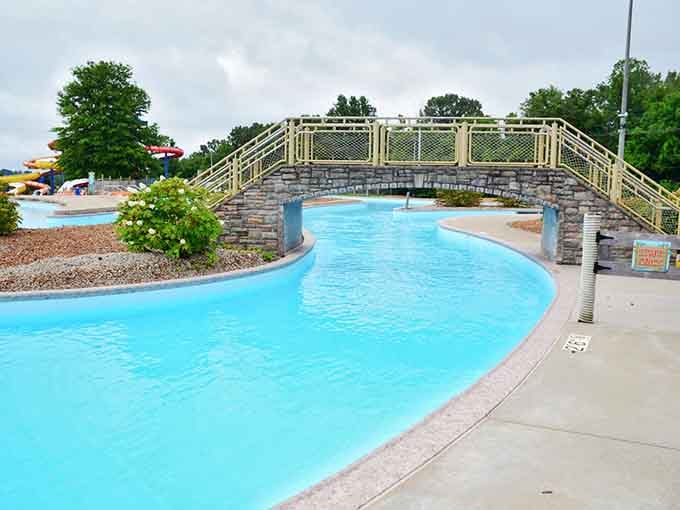 That elegant stone bridge arches over the lazy river like something from a resort vacation postcard.