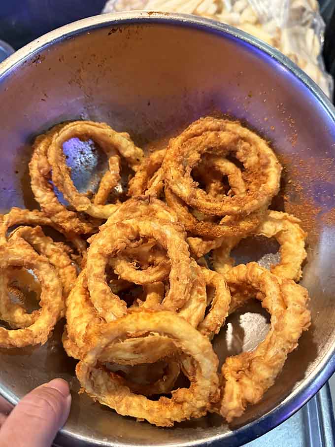 Onion rings this crispy and golden deserve their own standing ovation, possibly followed by an encore order.