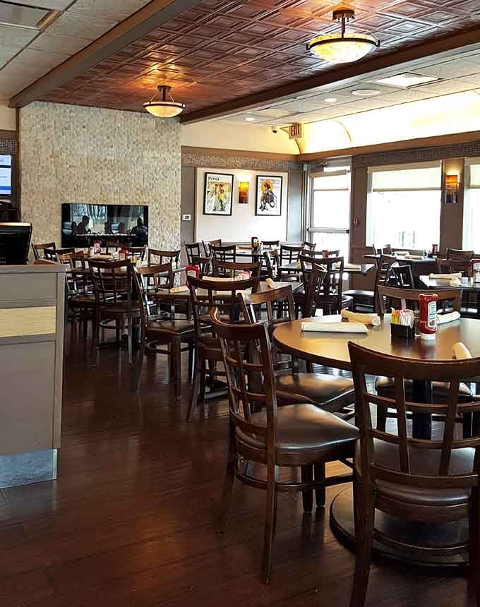 Spacious dining room with natural light streaming through windows, proving diners can be both cozy and airy.