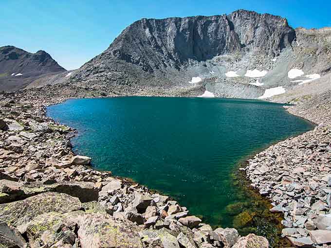 Lake Agnes at State Forest State Park sits like a turquoise jewel in an alpine setting that photographs can't capture.