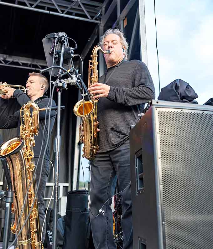 Live saxophone performances add unexpected sophistication to an event centered entirely around oversized vegetables and autumn celebrations.