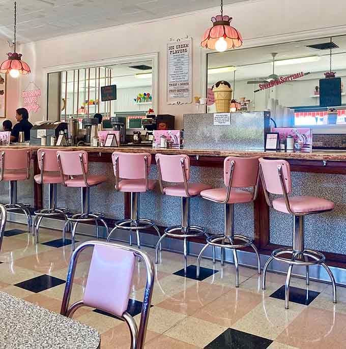 Those pink counter stools have supported countless elbows, dreams, and first dates since Eisenhower was running the country.