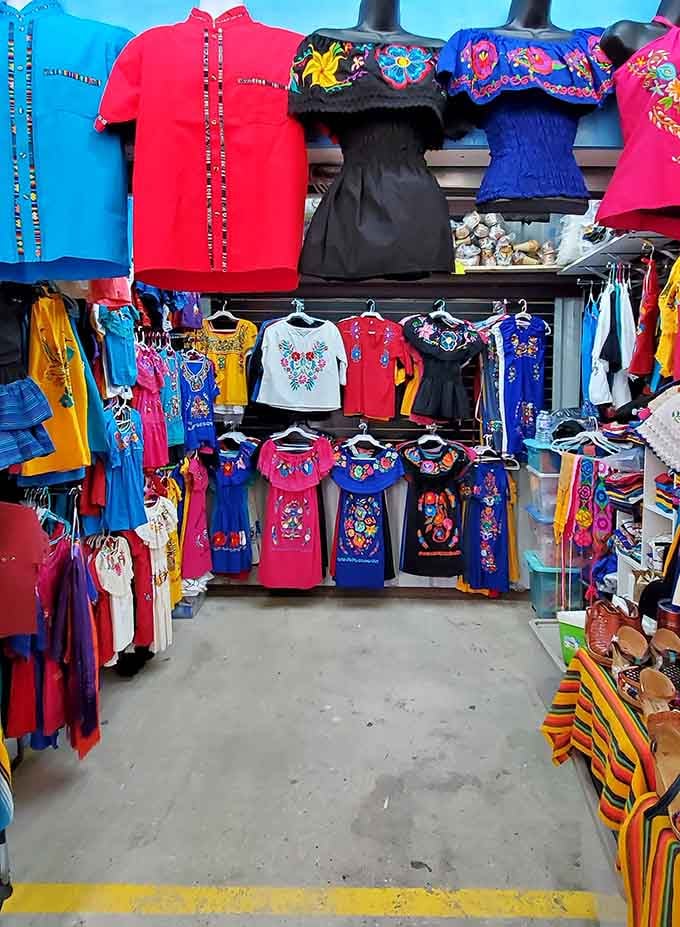 Embroidered blouses burst with floral patterns in jewel tones, transforming simple cotton into wearable celebrations of craftsmanship and color.