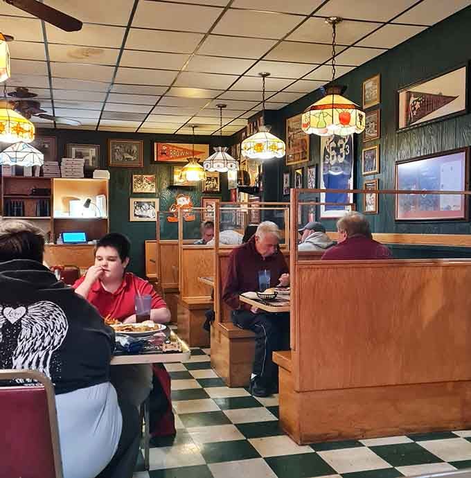 Real people enjoying real food in real booths, this is what authentic local dining looks like in action.