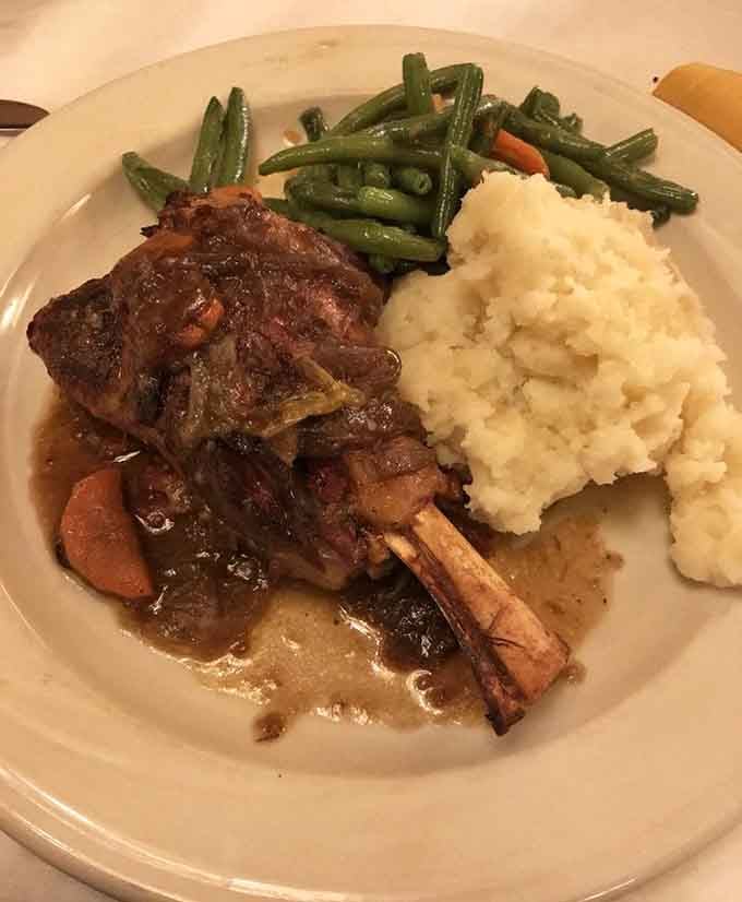 Lamb shank with mashed potatoes and green beans: comfort food elevated to something truly special here.