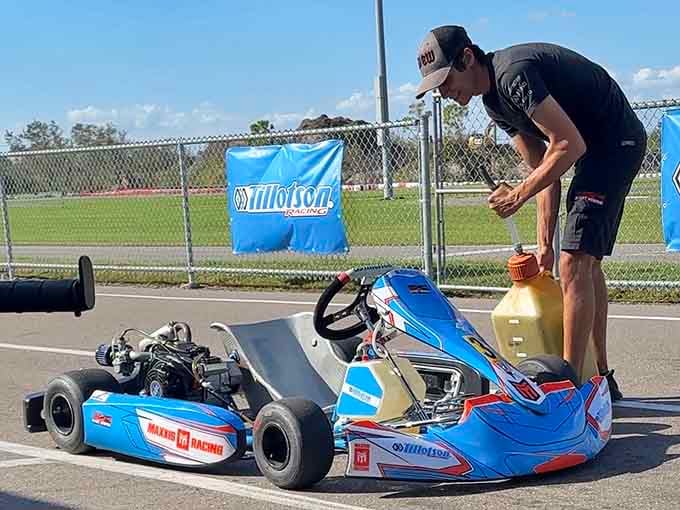 Careful hands adjust the machinery between sessions, because even the best equipment needs attention from dedicated mechanics and drivers.