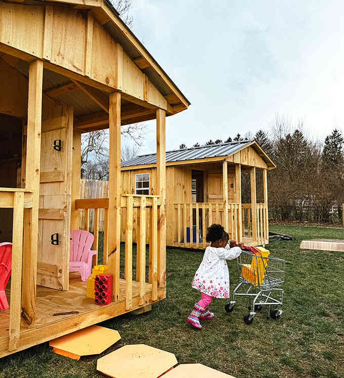 Miniature cabins where imagination runs wild, complete with tiny shopping carts for the full suburban experience.