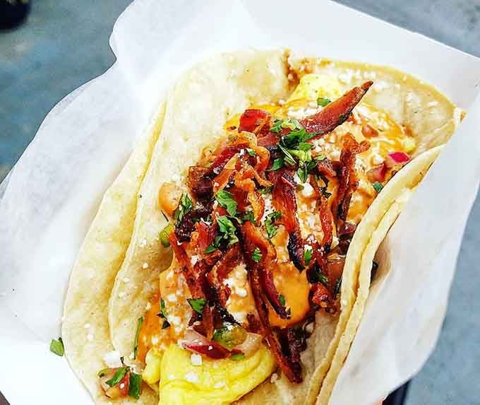 Breakfast tacos filled with scrambled eggs, crispy bacon, and enough toppings to make every morning feel like a celebration.